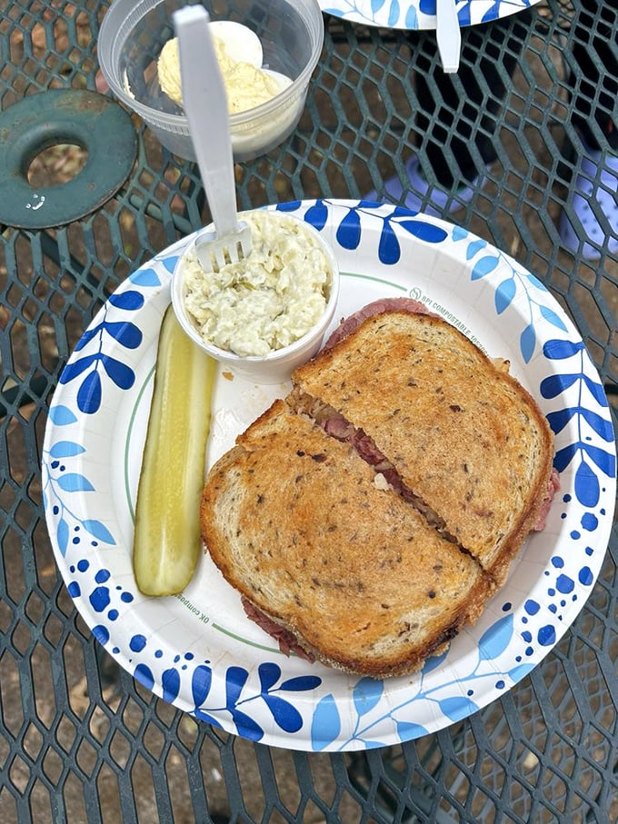 This sandwich isn't messing around. The pickle stands guard alongside a creation that demands both hands and your full attention.