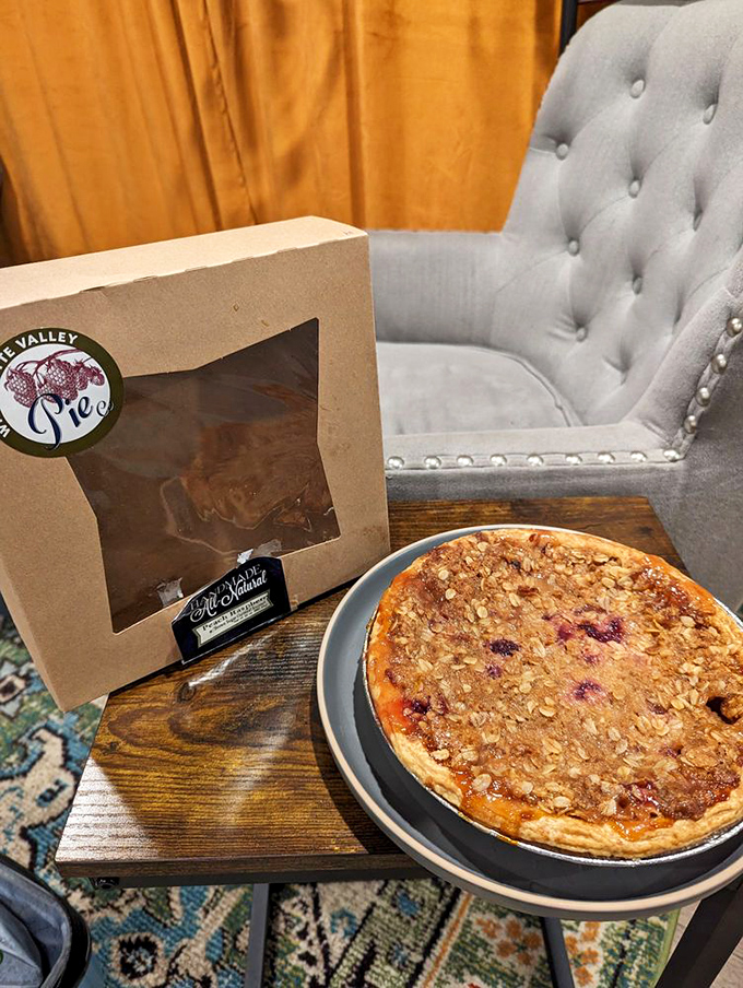 Crumb-topped fruit pies showcase the bakery's versatility. The almond slivers aren't just decoration&mdash;they're the jewelry on this edible crown. 