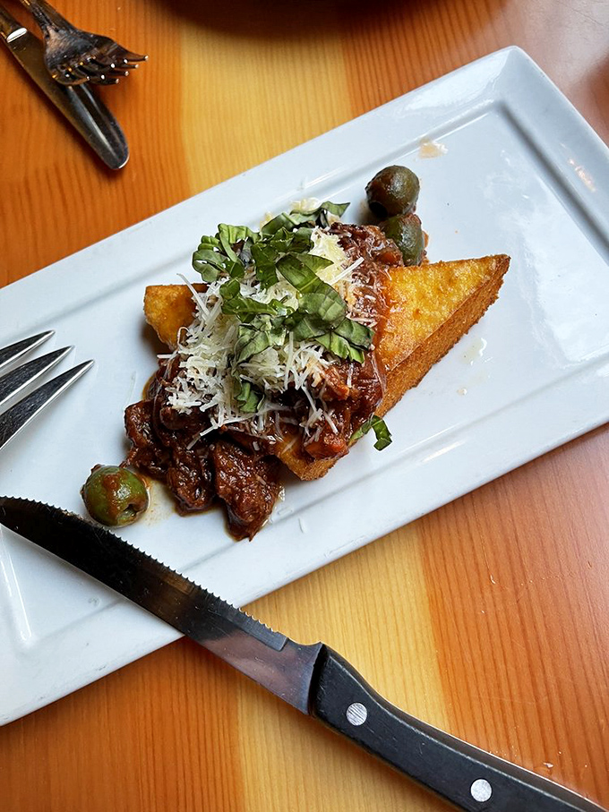 This polenta cake with olives isn't just an appetizer&mdash;it's the opening act that steals the show