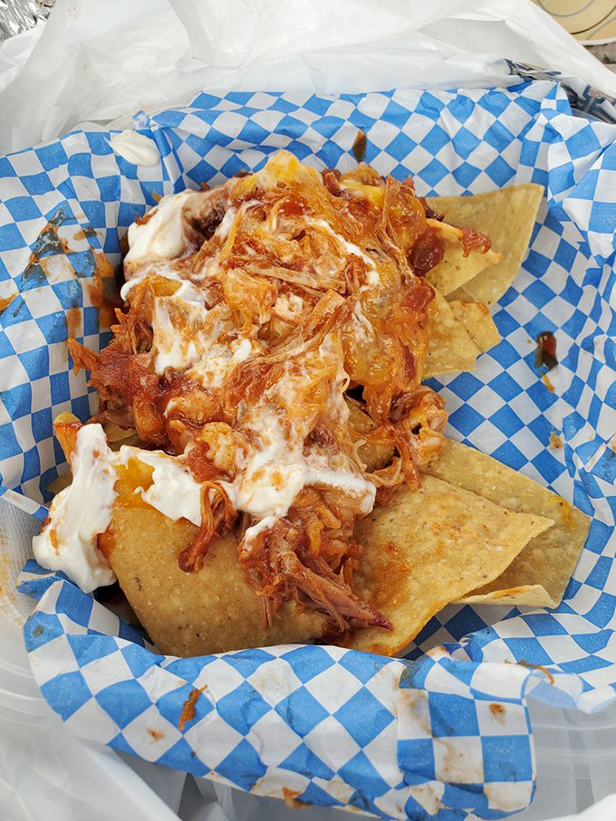 BBQ nachos—where Tex-Mex meets Southern smoke in a beautiful culinary marriage. The sour cream melting into pulled pork creates bite-sized flavor bombs.