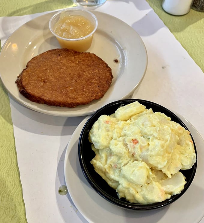 The potato pancake arrives golden and crisp, with a side of applesauce that makes you question why you'd ever eat potatoes any other way.