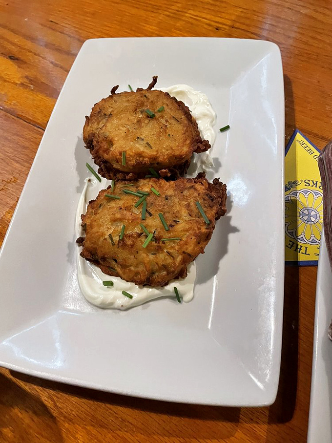 Golden potato pancakes that crackle with each bite. Served with a cloud of sour cream, they're a testament to the power of simple ingredients. 