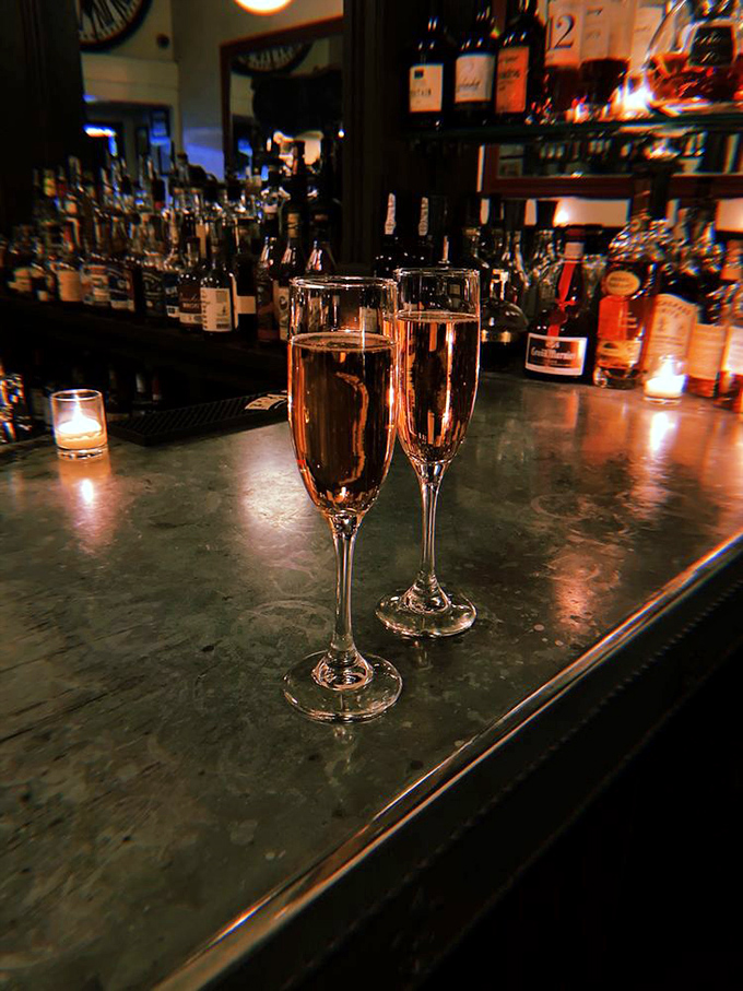 Two glasses of bubbly against the bar's warm glow&mdash;sometimes the simplest pleasures are the most memorable.