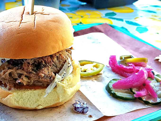 This pulled pork sandwich is the definition of simple perfection. Tender strands of smoky meat on a soft bun &ndash; no unnecessary frills, just pure satisfaction. 