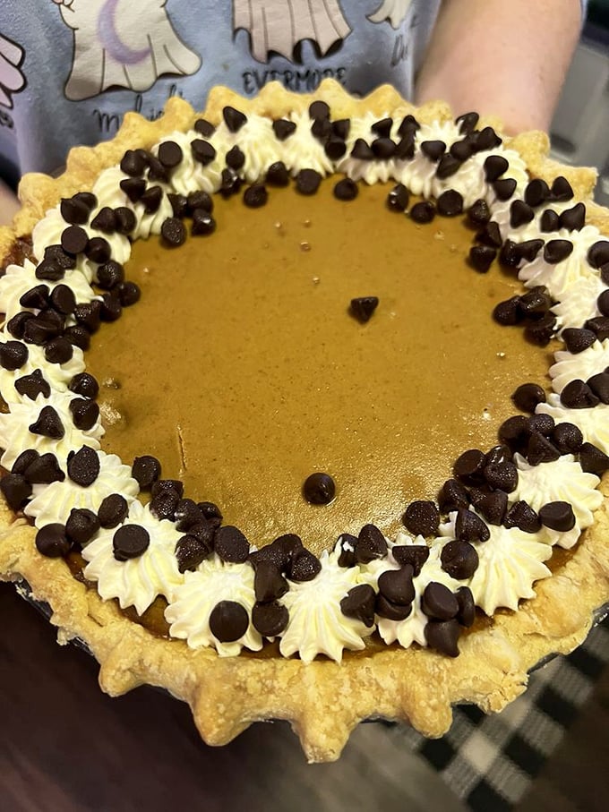 The whipped cream border studded with chocolate chips isn't just decoration—it's a flavor moat protecting a pumpkin treasure within.
