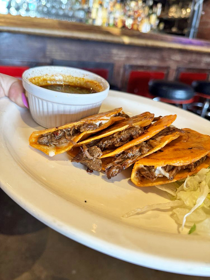 Quesabirria tacos&mdash;where beef stew and grilled cheese had a beautiful baby. That consomme cup isn't a side; it's an essential dipping pool of flavor.