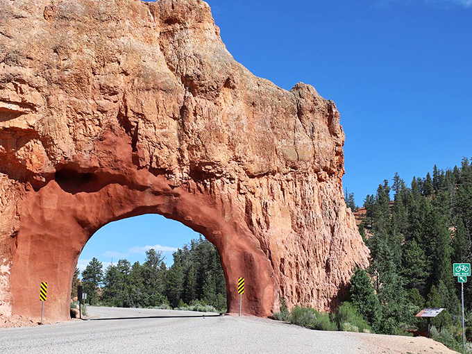 Driving through Red Canyon's tunnel feels like passing through a portal to another dimension, where the rules of ordinary geology no longer apply.