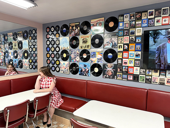 Vinyl records line the walls like trophies of musical history, creating the perfect backdrop for diners pretending they're extras in their own American Graffiti scene.
