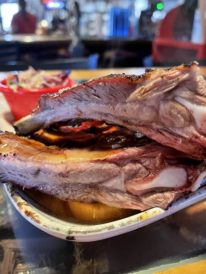 Ribs so substantial they command their own zip code, showing off that signature smoke ring that makes barbecue enthusiasts weak at the knees.