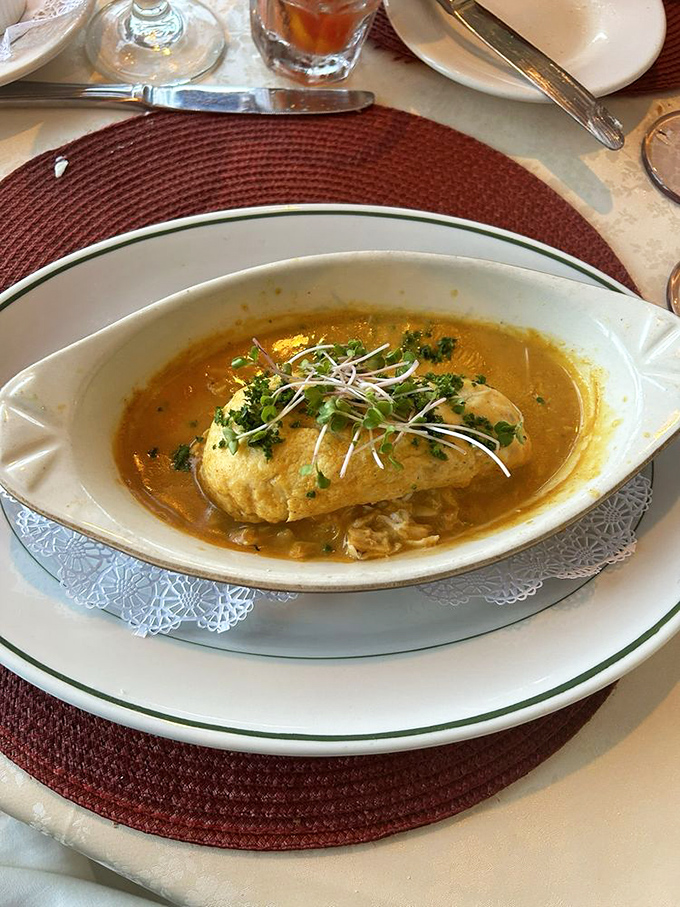 The salmon appetizer arrives like a delicious letter from the sea, complete with a colorful salad as its postage stamp. 