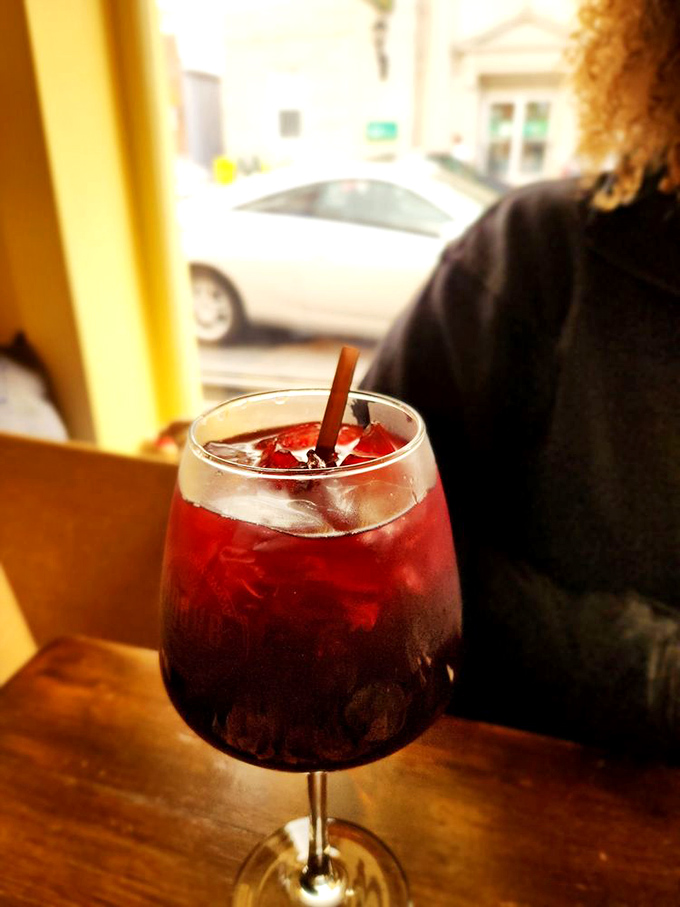 A sangria so photogenic it belongs on a magazine cover, with that cinnamon stick serving as both garnish and invitation.