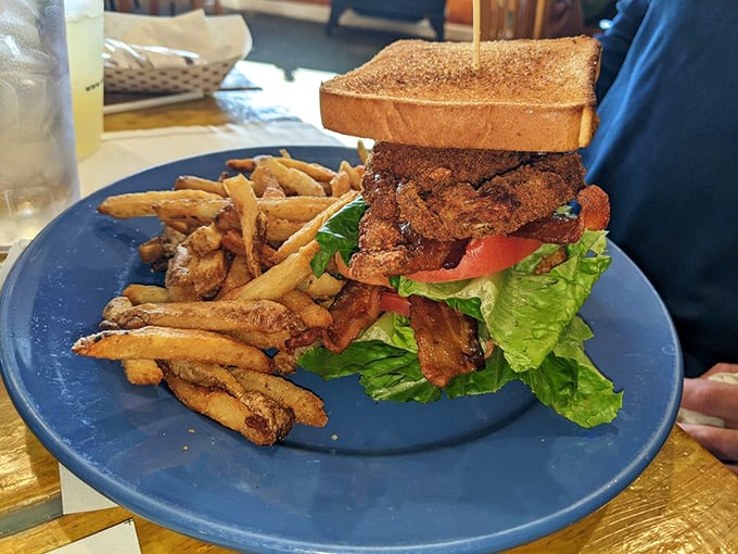 A sandwich built like a skyscraper&mdash;soft shell crab BLT reaching impressive heights. Architecture you can eat, with fries as the foundation.