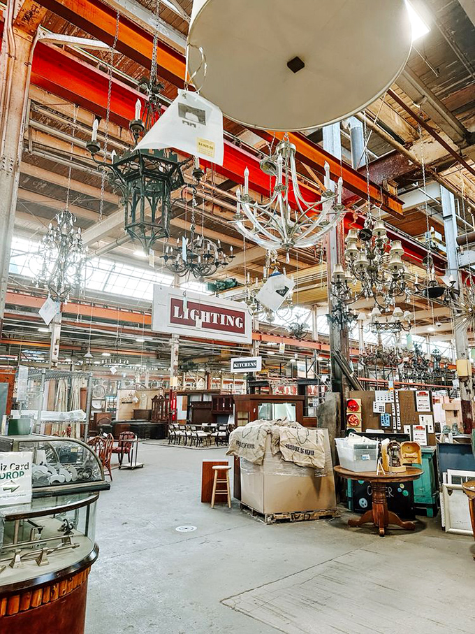 Industrial beams frame an endless sea of furniture possibilities. The overhead crane suggests these treasures have some serious weight to their history. 