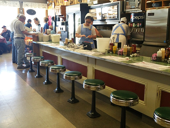 Staff in traditional Amish attire work with practiced efficiency, carrying forward culinary traditions that pre-date food trends by generations.