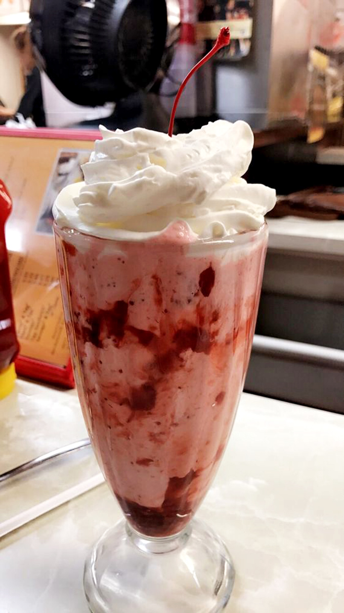 This strawberry milkshake isn't just a drink, it's architecture&mdash;a cathedral of cream topped with a cherry spire.