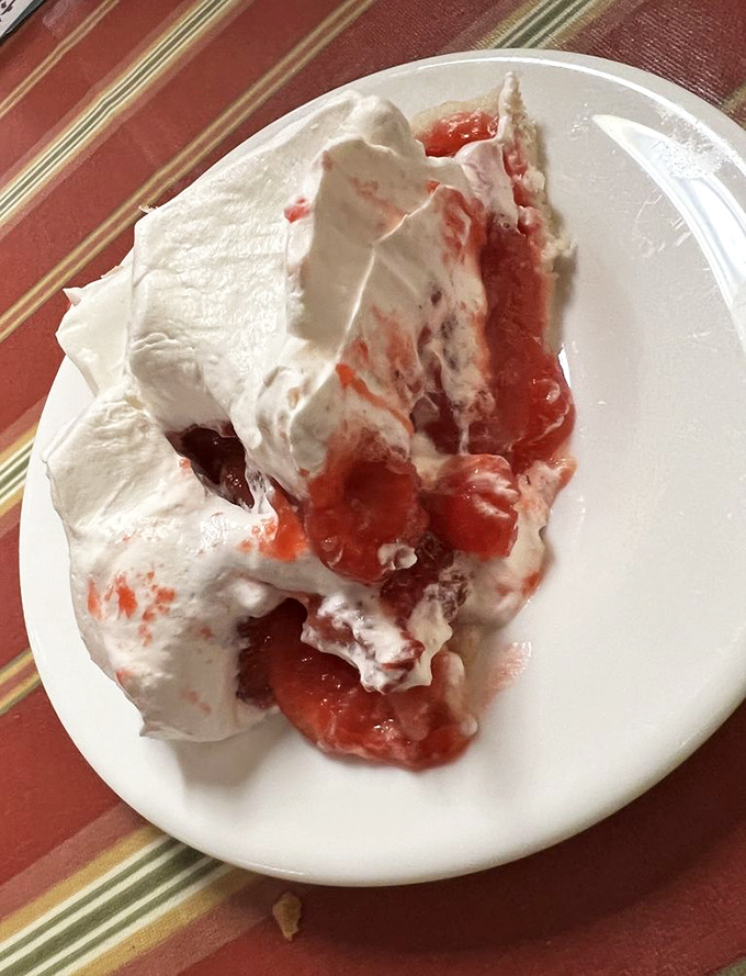 Strawberry pie with a cloud of whipped cream so generous it looks like winter arrived early&mdash;only this snowstorm tastes like summer berries and joy.