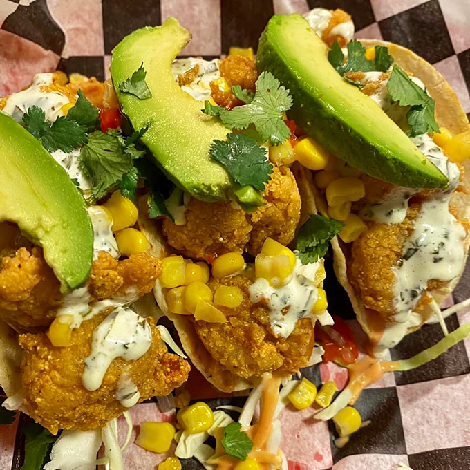 Fish tacos with avocado slices so perfect they look like they've been practicing their pose for Instagram.