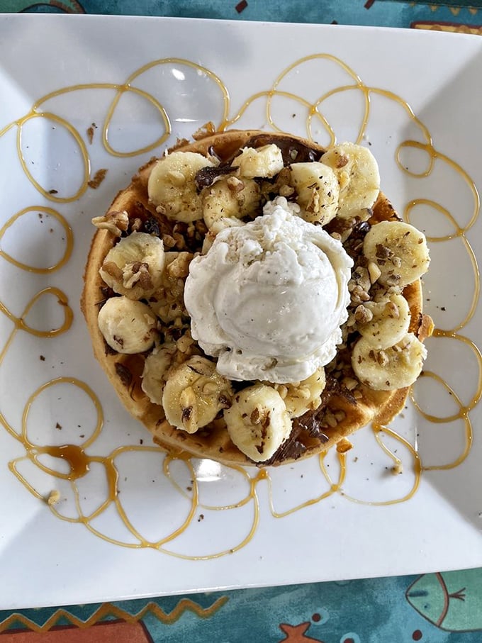 This waffle doesn't just have toppings&mdash;it has an entourage. Bananas, nuts, caramel, and ice cream creating a sweet symphony on a plate.