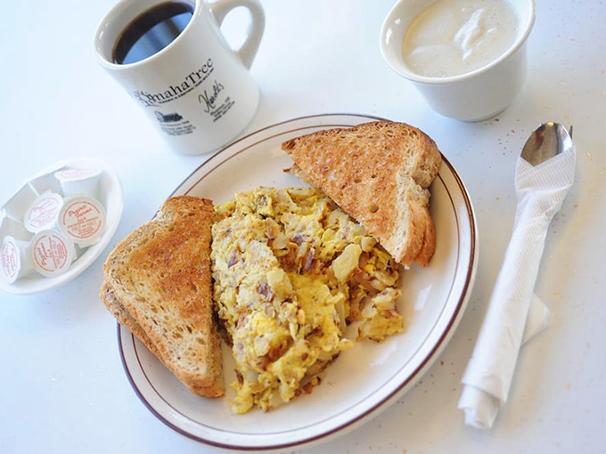 A plate that speaks fluent Midwestern &ndash; scrambled eggs, toast, and a side that proves nobody does comfort food quite like Nebraska.