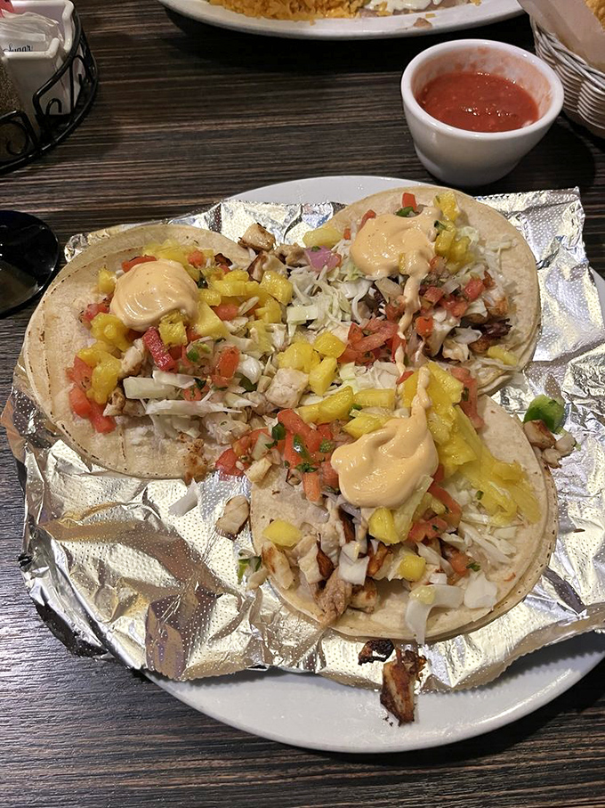 These tacos del mar showcase seafood that tastes like it just had a conversation with the lime squeezing over it.