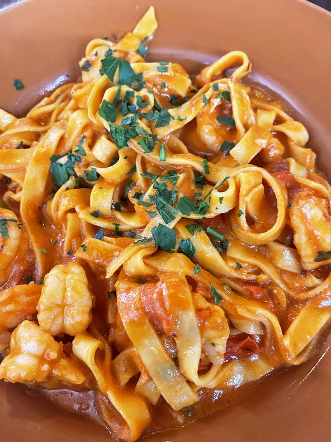 Tagliatelle ribbons dancing with Bolognese and shrimp—proof that sometimes breaking tradition leads to delicious revolution. Sorry, nonna.