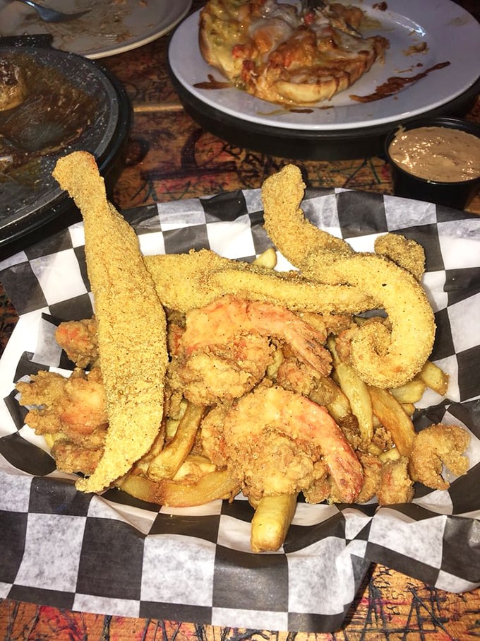 The seafood basket that answers all your cravings at once &ndash; fried catfish, shrimp, and sides nestled together in crispy, cornmeal-crusted harmony.