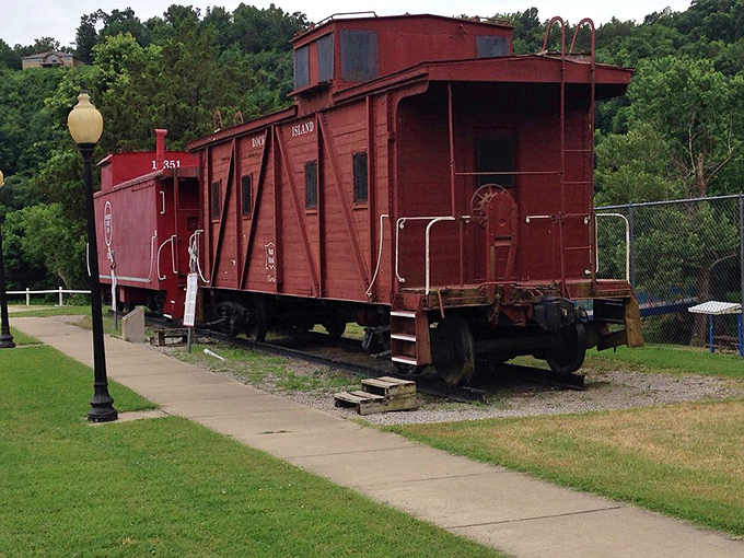 This red caboose didn't choose retirement&mdash;retirement chose it. Now it stands as a cheerful reminder of Cotter's railroad heritage.
