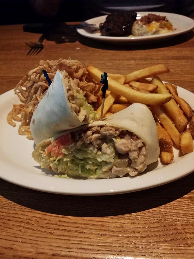 This wrap isn't just holding ingredients&mdash;it's containing a flavor explosion that's one bite away from making you forget your table manners entirely.