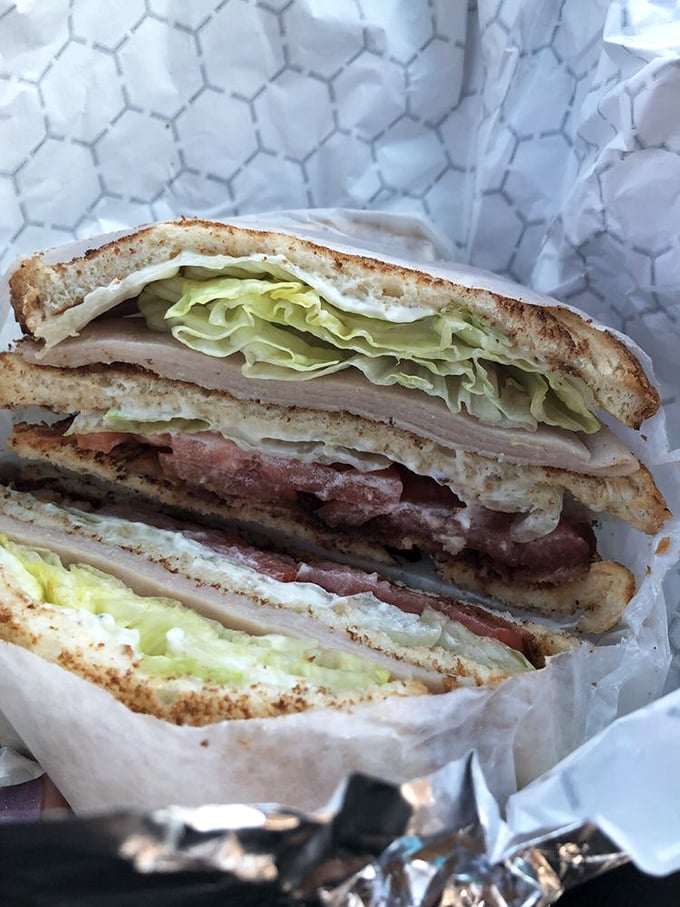 The club sandwich: where turkey, bacon, and fresh veggies create the architectural marvel that's been fueling Arlington lunch breaks for generations.