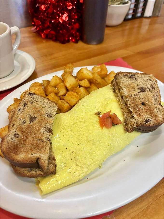 An omelet should be fluffy, generous, and surrounded by perfectly cooked potatoes. This one checks all three boxes with enthusiastic flair.