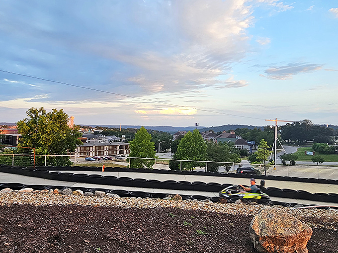 A lone driver enjoys the track with the beautiful Ozark mountains as backdrop. Racing with a view beats the morning commute any day.