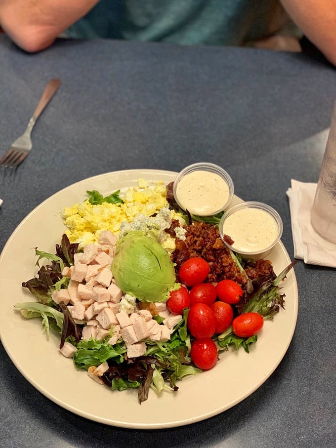 A salad that doesn't feel like punishment. Fresh vegetables, protein, and avocado arranged so beautifully you almost feel bad disturbing it. Almost.