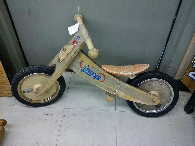 A wooden balance bike that's already broken in the hard part&mdash;learning to ride. Some lucky child's first wheels await their next adventure.