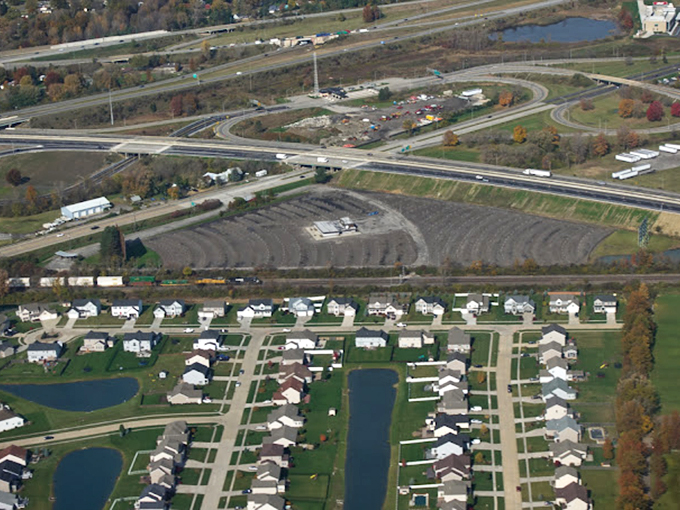 From above, the drive-in's curved viewing rows reveal themselves&mdash;a carefully engineered amphitheater for automobiles.