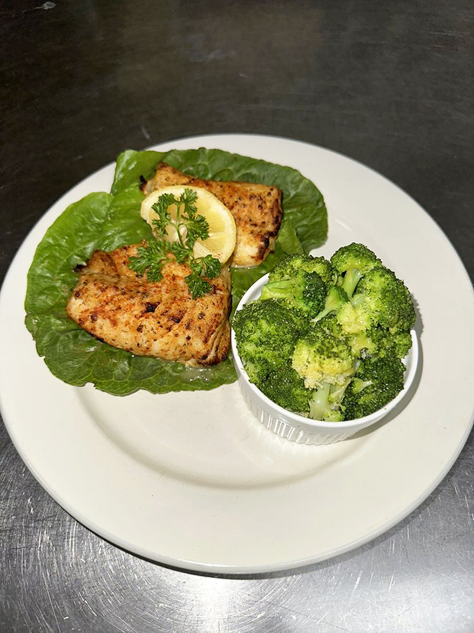 Fresh cod served with vibrant steamed broccoli offers a lighter option that doesn't skimp on flavor. Proof that seafood inland can still make waves.