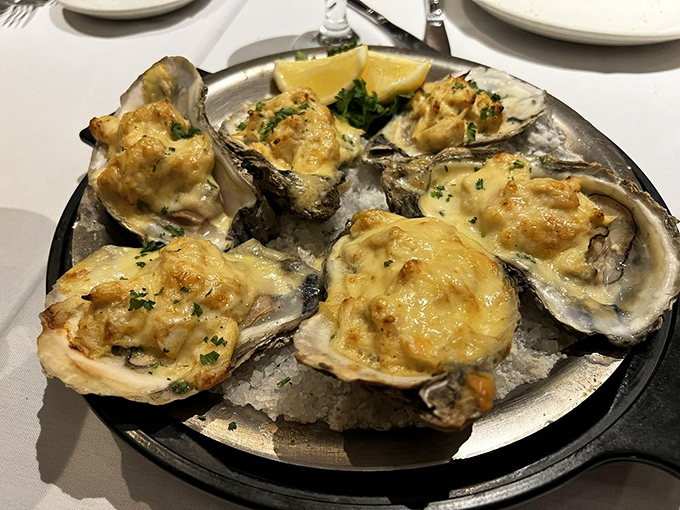 Oysters Rockefeller gets a Maryland makeover. These baked beauties under golden cheese make sharing nearly impossible&mdash;order your own plate.