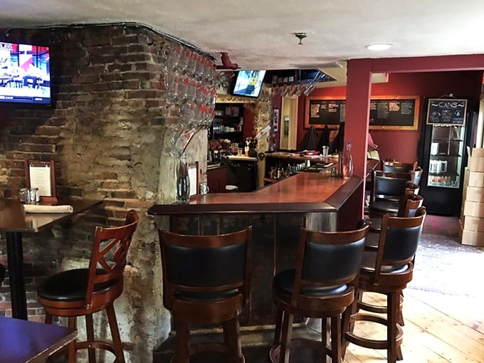 Exposed brick meets polished wood at this inviting bar, where conversations flow as smoothly as the local brews on tap.