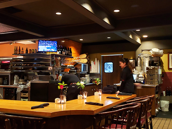 The bar isn't just where drinks are made&mdash;it's command central for culinary happiness. Every plate that emerges is another mission accomplished.