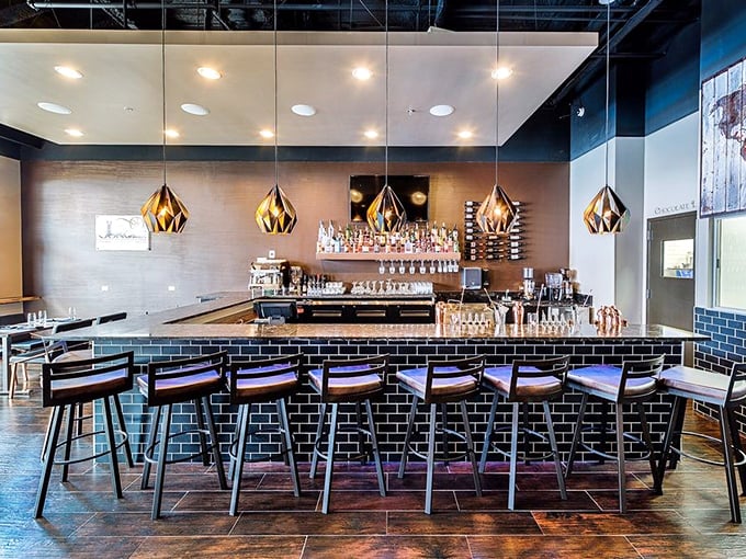 A bar that understands the serious business of chocolate pleasure. Those geometric pendant lights hint at the precision behind every chocolate-infused creation.