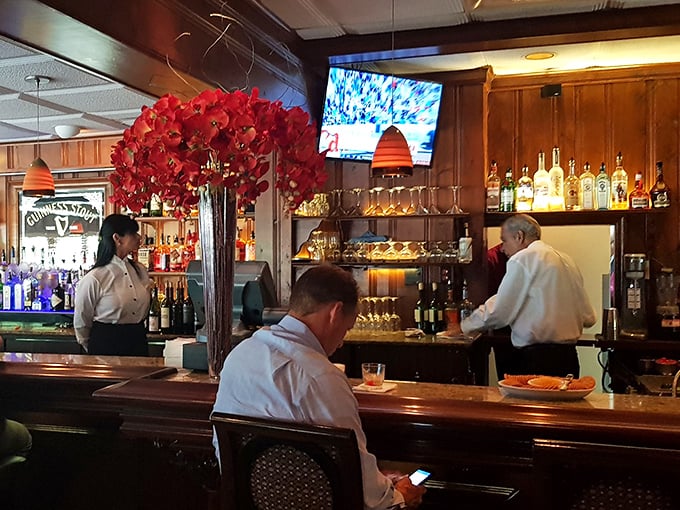 At the bar, traditions are poured and stirred by professionals who understand that a proper drink sets the tone for everything that follows.