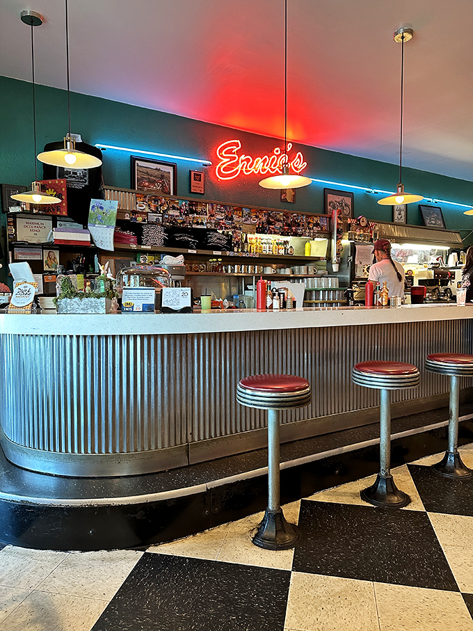 That neon sign isn't just illuminating the bar—it's a beacon calling hungry travelers home to a place where everybody eventually knows your order.