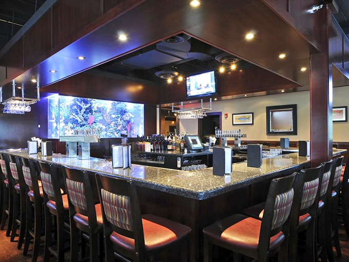 The bar area features an impressive aquarium&mdash;because nothing builds seafood confidence like seeing the restaurant invest in actual marine life. 