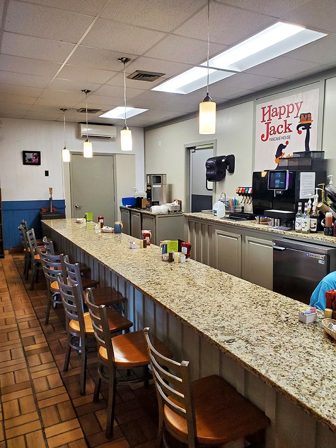 The counter seating offers front-row tickets to the breakfast show, where coffee flows freely and morning conversations bloom.