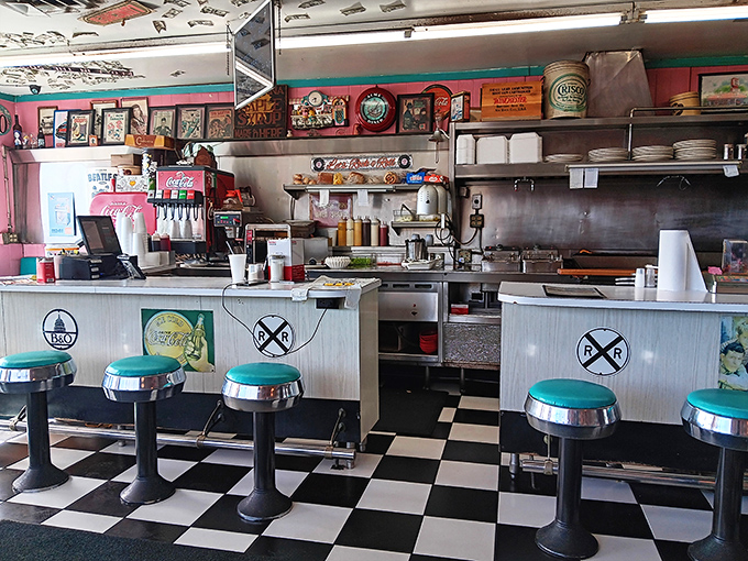 Chrome stools invite patrons to belly up to a counter that's witnessed countless coffee refills and life stories. American diner culture preserved.