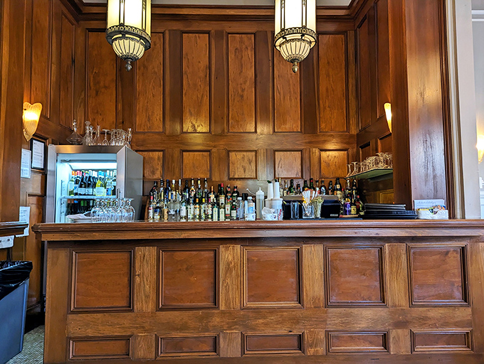 Behind this handsome bar, cocktail magic happens. Wood-paneled elegance that would make the Rat Pack feel right at home.
