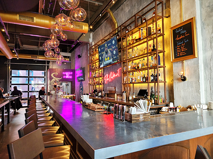A bar that understands the gravity of proper brunch libations. Those hanging globe lights are basically celestial bodies orbiting your mimosa.