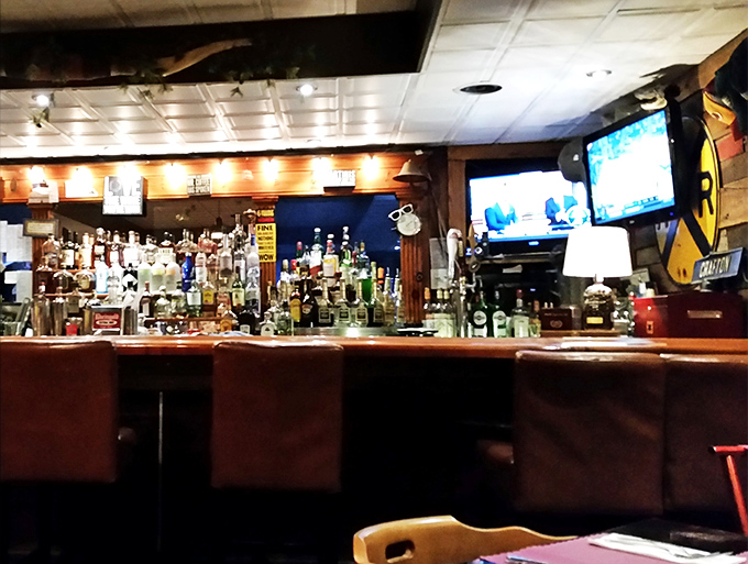 A bar stocked for serious business—because choosing between bourbon and scotch to accompany your steak is life's most pleasant dilemma.