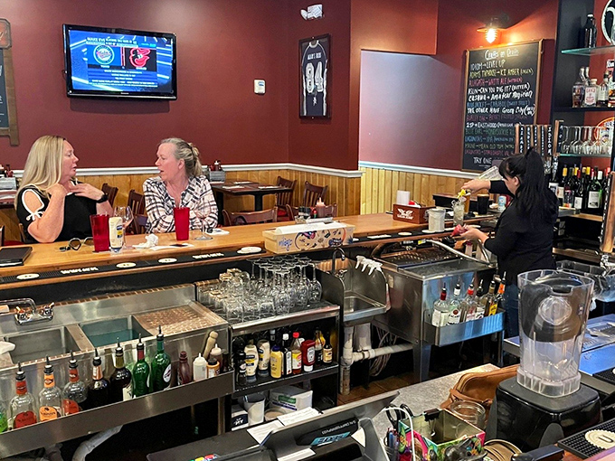 The bar area&mdash;where strangers become friends, and friends become family, all bonded by the universal language of good food and drink.