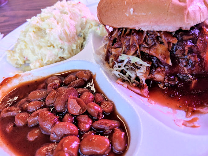 These aren't just beans; they're tiny flavor sponges that have been hanging out with brisket all day, absorbing smoky wisdom.