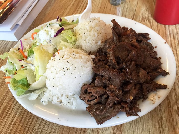 Beef so tender it practically melts into the rice, with a side salad that's more than an afterthought. Simple food executed with care.